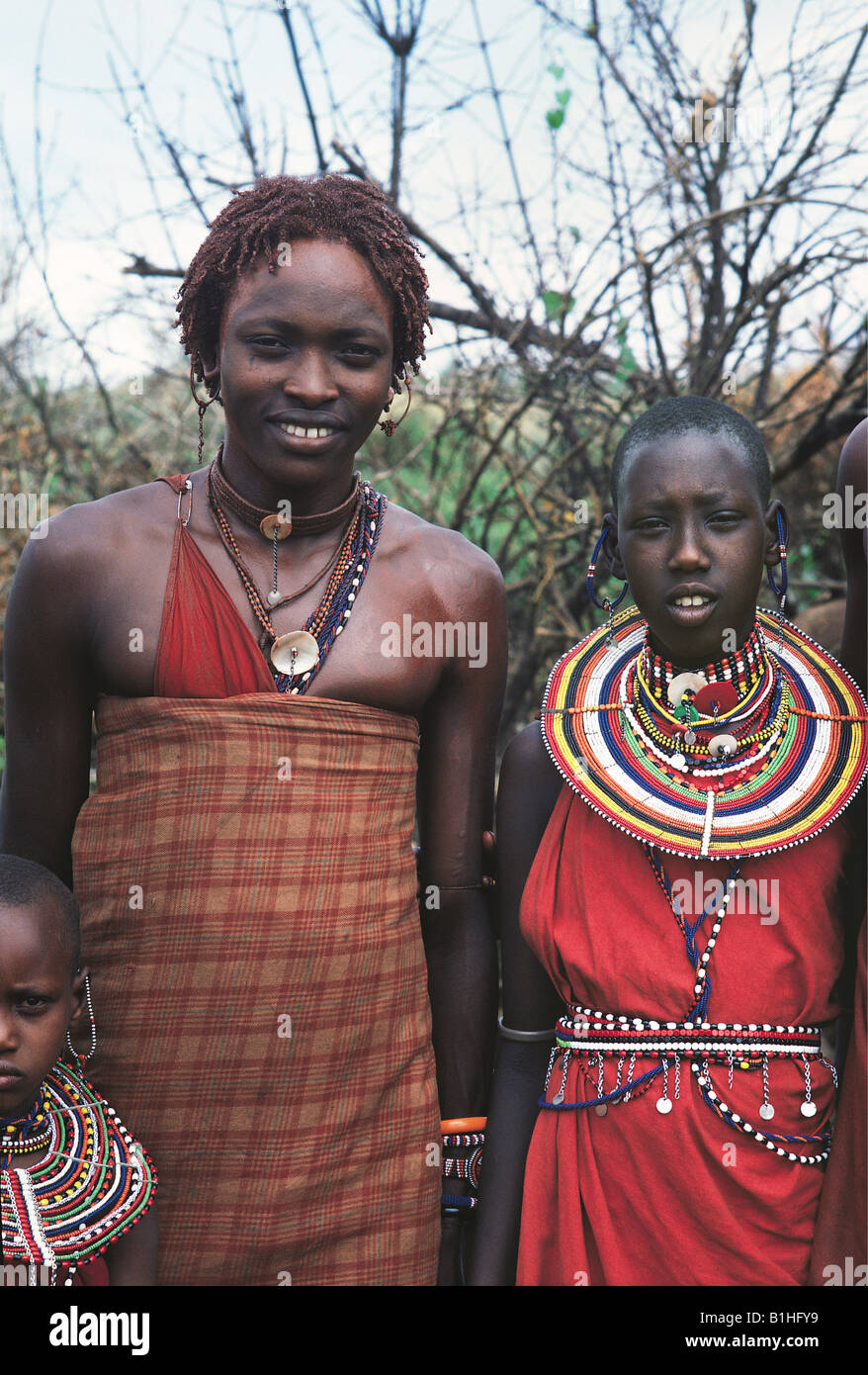 Maasai moran warrior and girl pose for a portrait Kenya East Africa ...