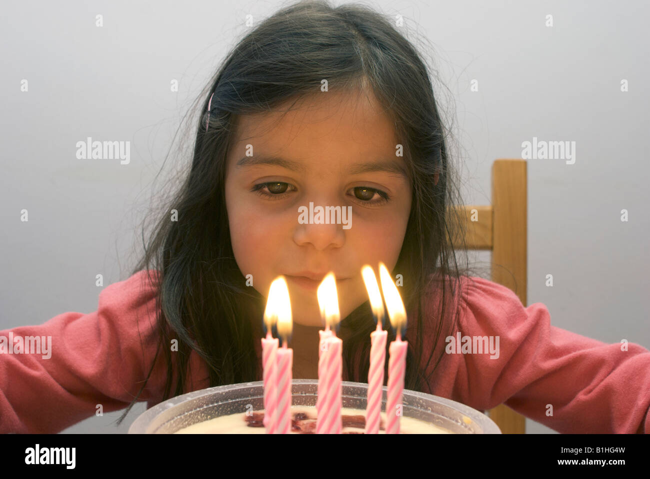 Girl looks at birthday cake hi-res stock photography and images - Alamy