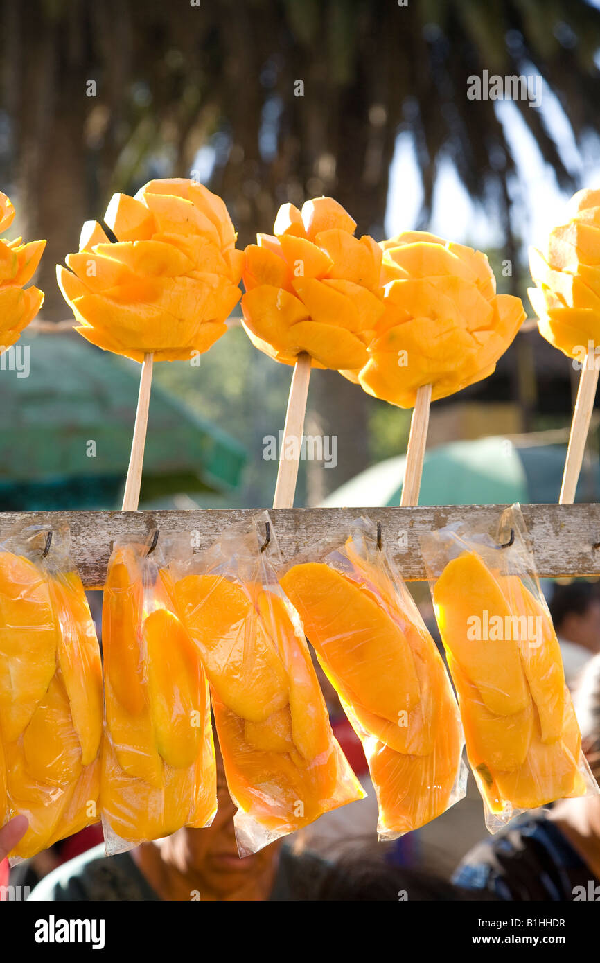 Cut up mango is sold as lollies and in bags at a stall in Antigua ...