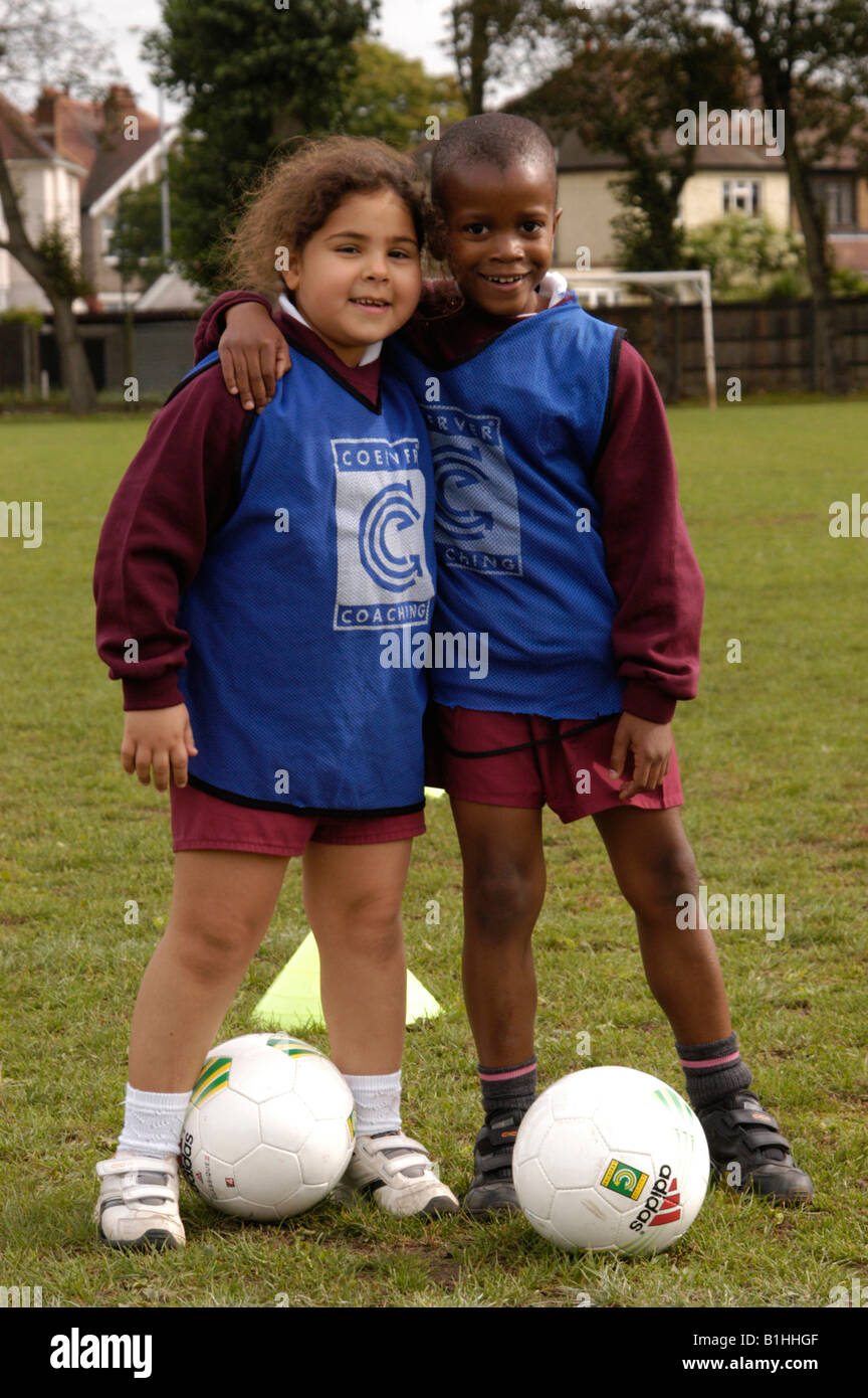 two football team members hugging Stock Photo - Alamy