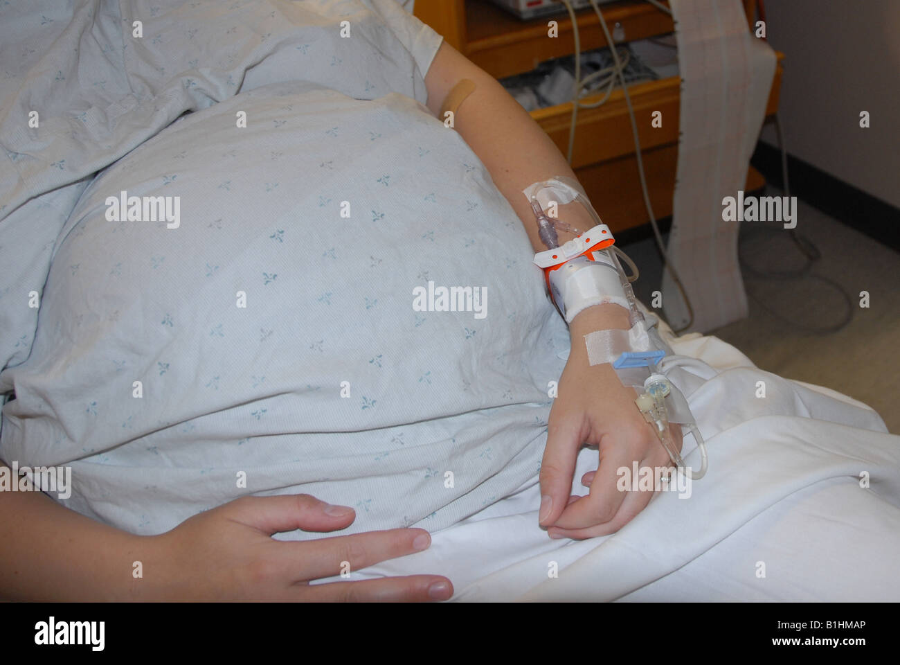 A pregnant woman's arm with an I.V. before she goes in for her delivery ...