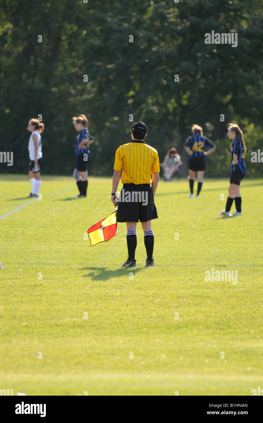 Soccer players and referee Stock Photo - Alamy