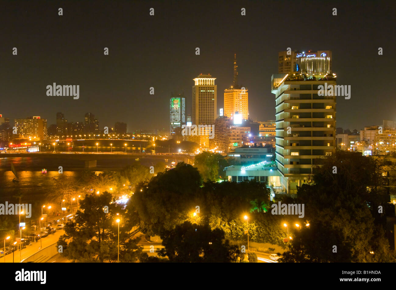 Hotels and high rise buildings along the Nile River at night in ...