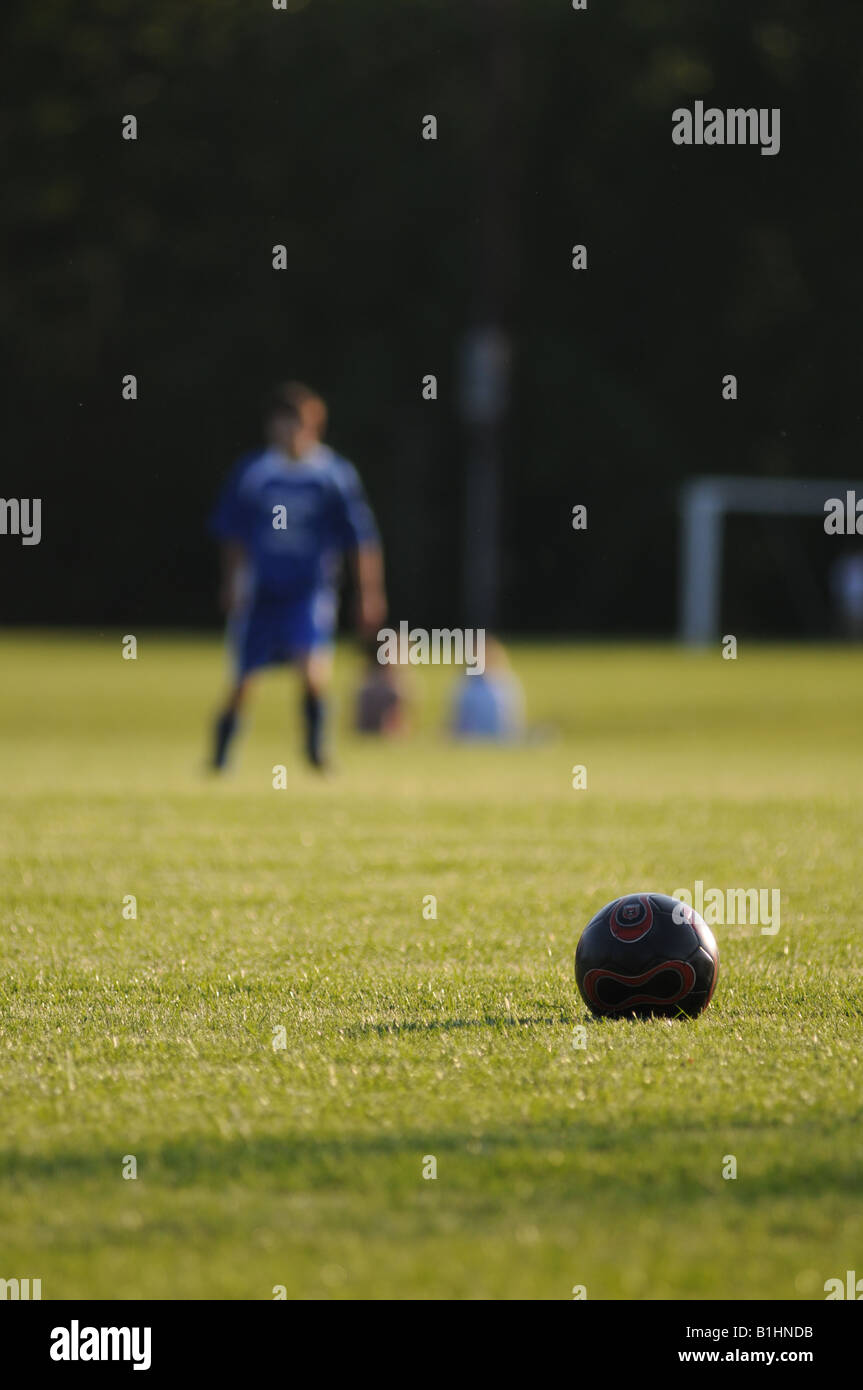Soccer ball and player Stock Photo - Alamy