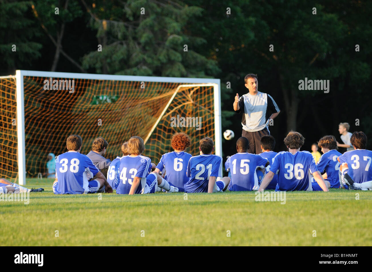 Pep talk before the game Stock Photo - Alamy