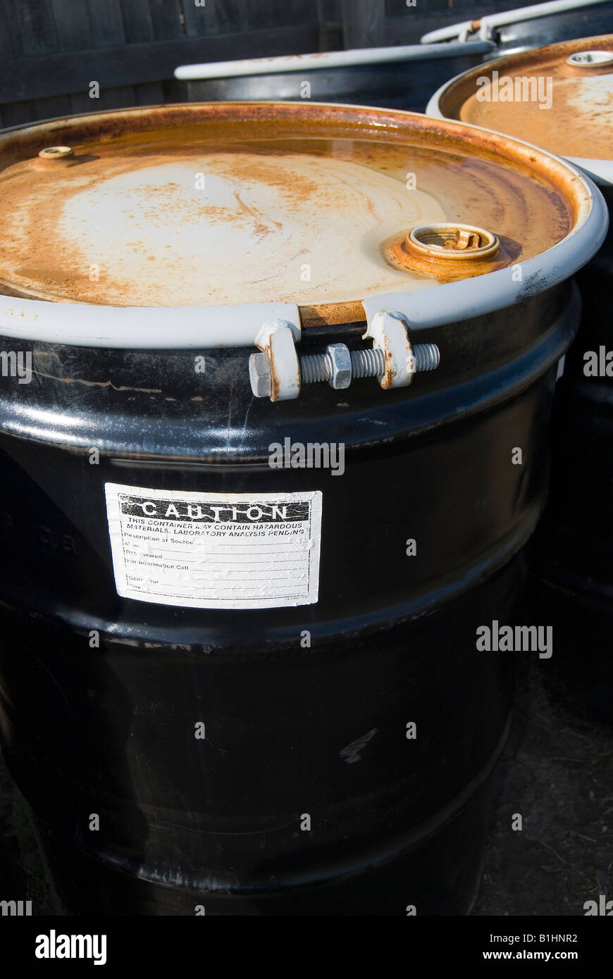 Rusting 55 gallon metal drum containing hazardous materials from ...