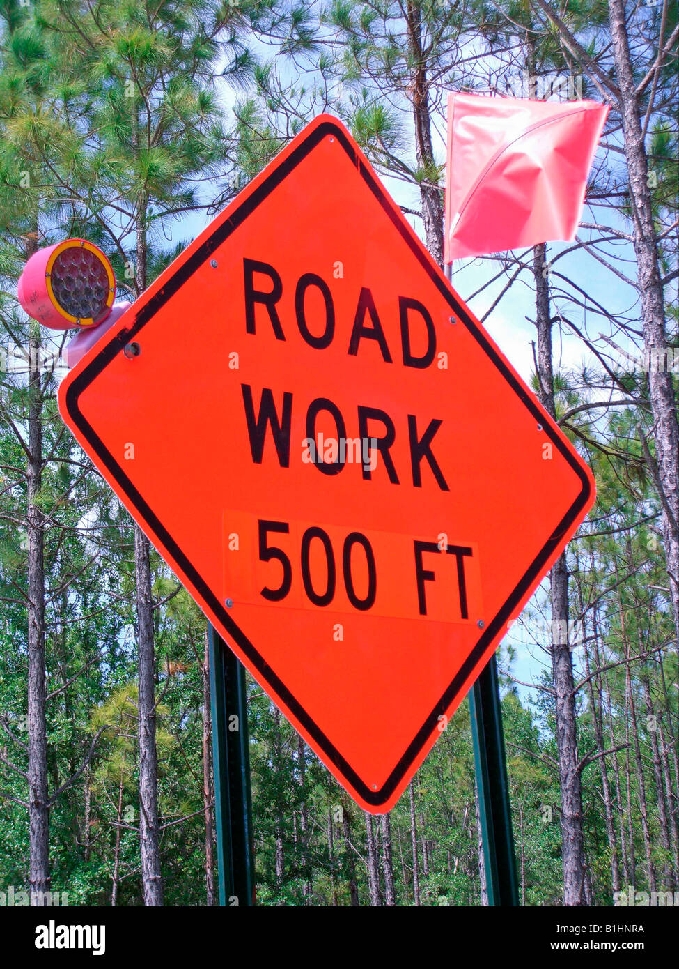 Orange construction flag sign hi-res stock photography and images - Alamy