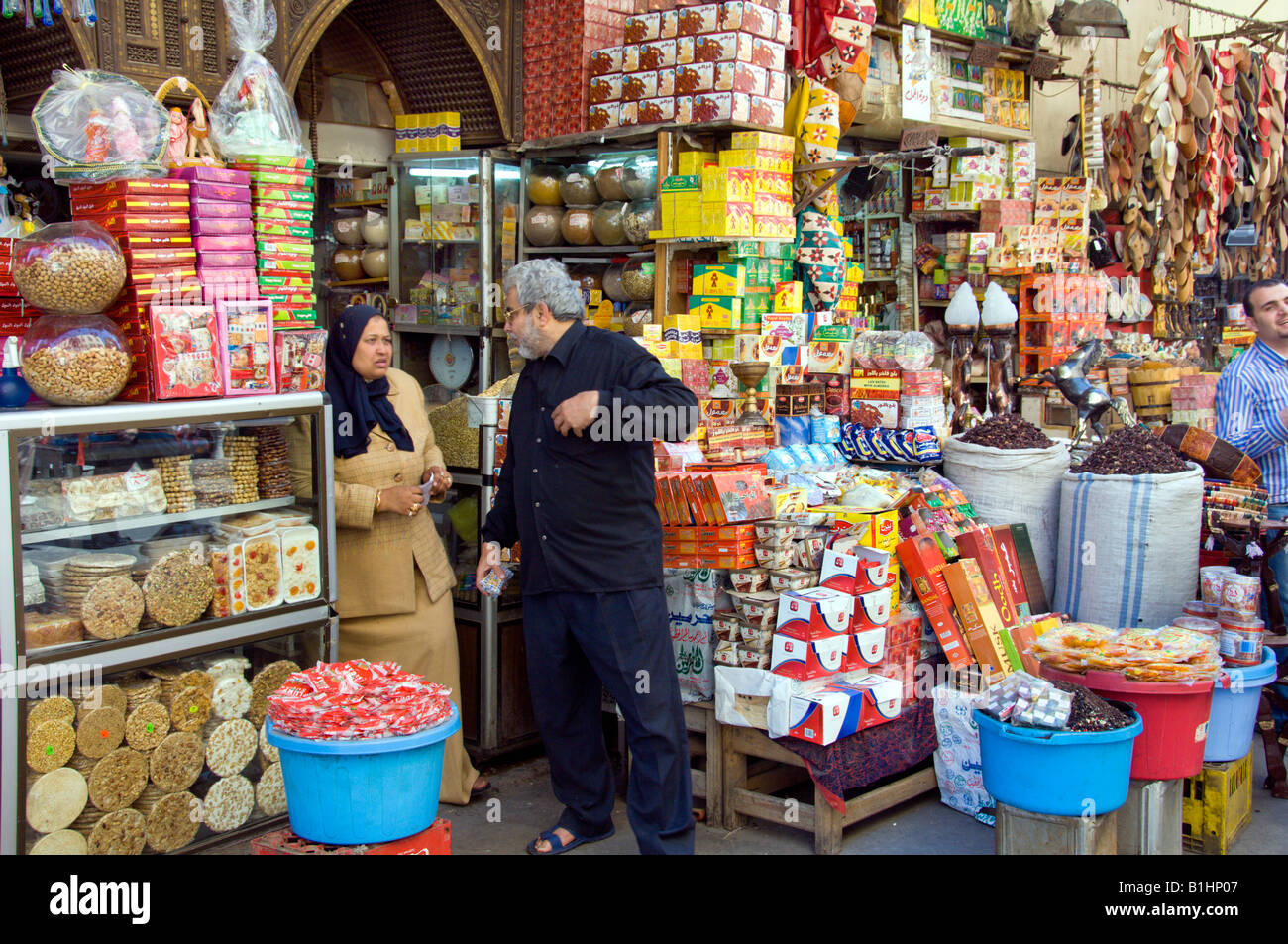 Customers buying at the shops in the Khan El Kahalili outdoor market in ...