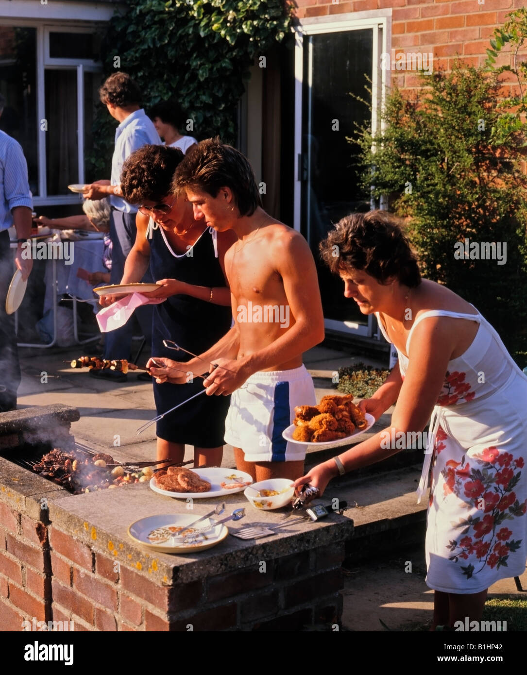 Barbecued food being cooked and served Stock Photo - Alamy