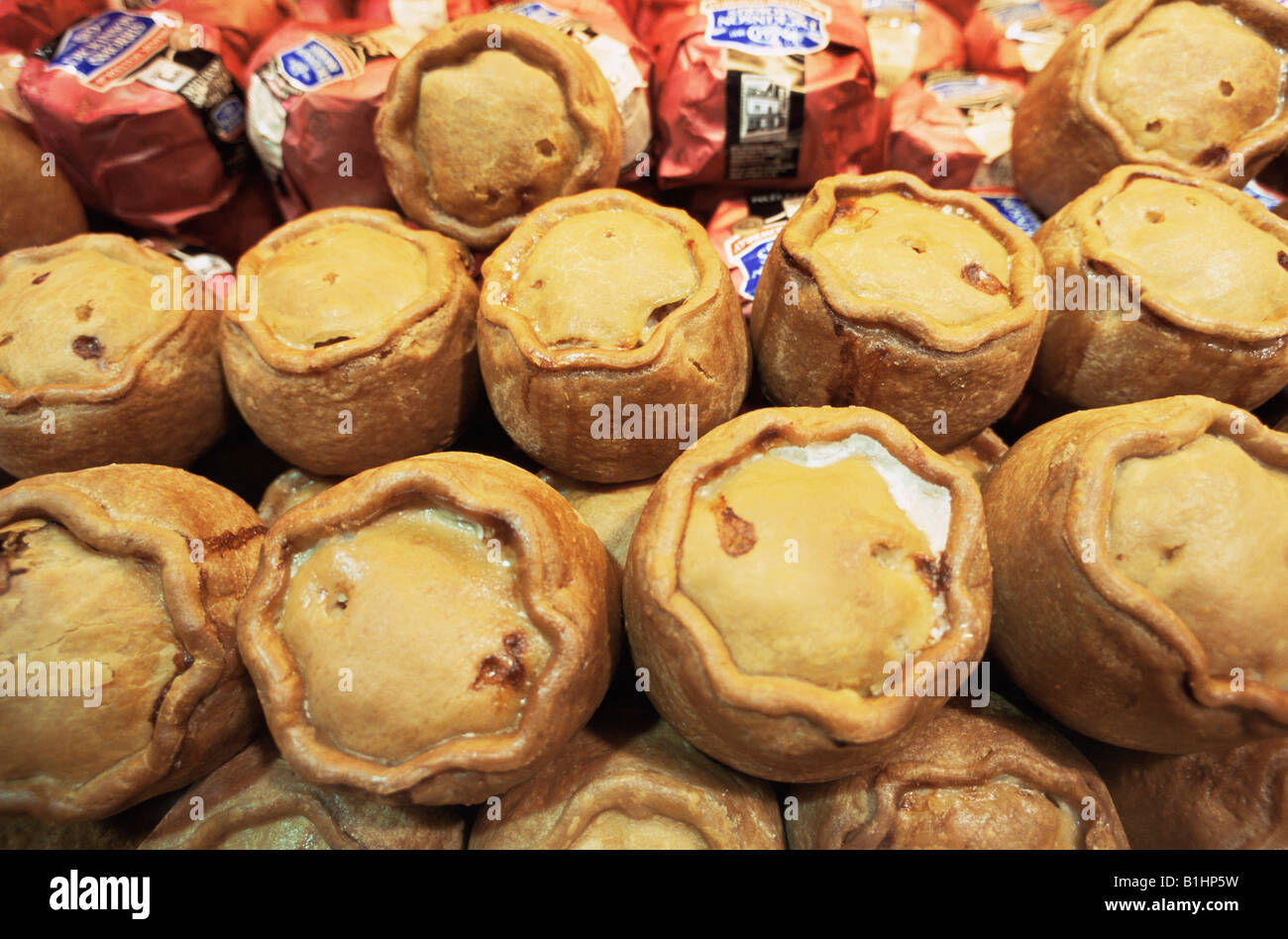 Close-up of pork pies in the display window of a store, Ye Olde Pork ...