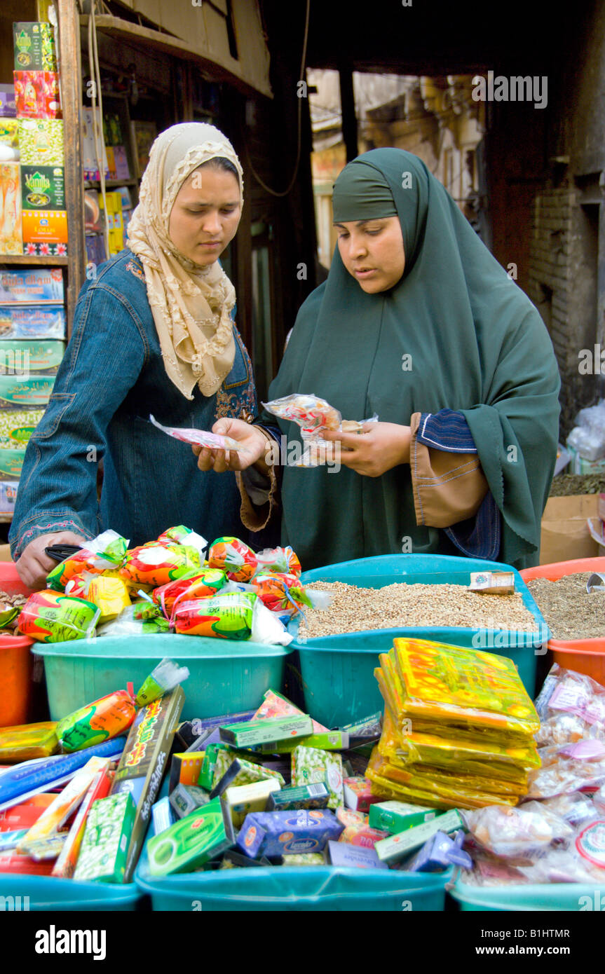 Two muslim women buy goods at a shop in the Khan El Khalili market in ...