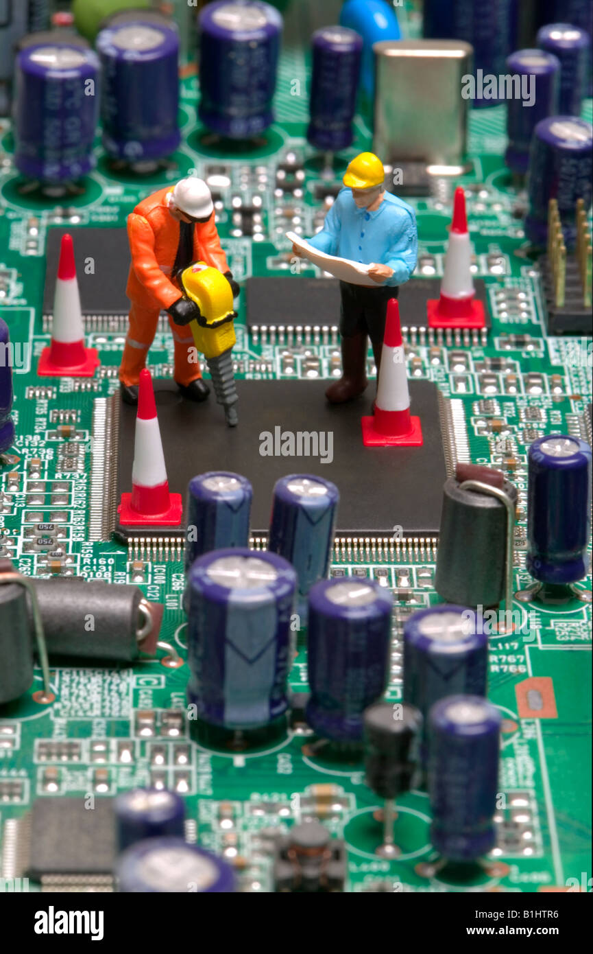 Mini workmen repairing a broken circuitboard Stock Photo - Alamy