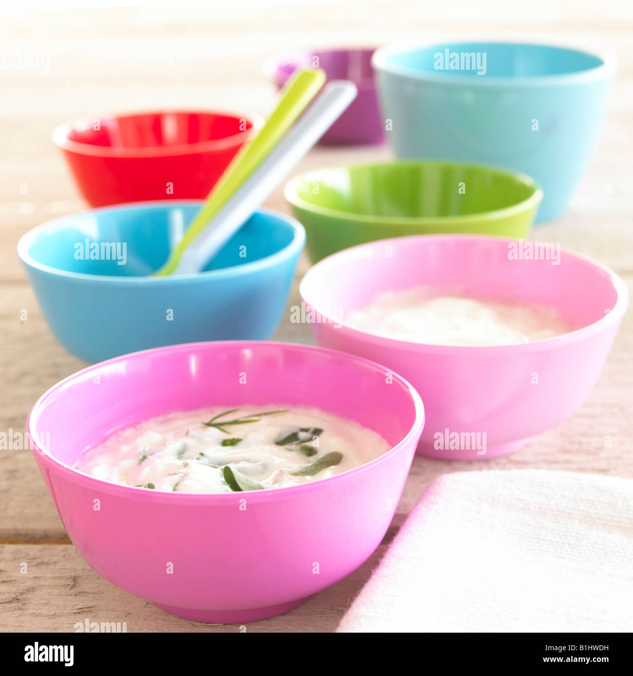 Quark in pastel coloured bowls Stock Photo - Alamy
