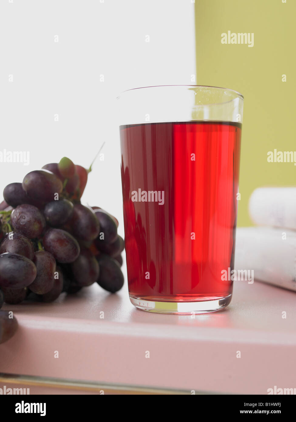 Glass of red grape juice Stock Photo - Alamy