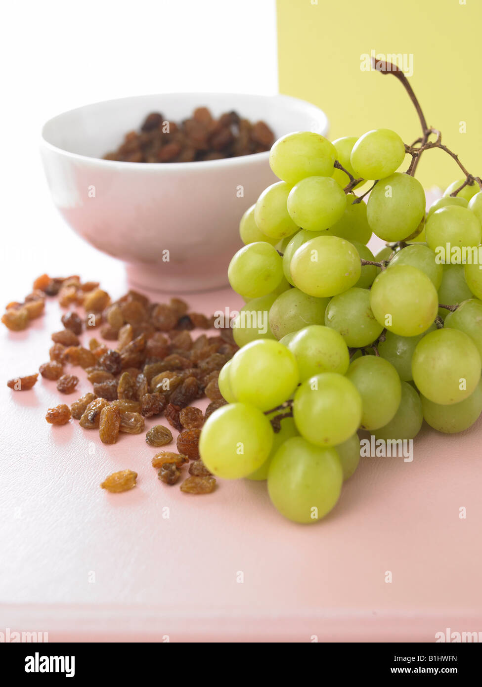Bunch of white grapes and raisins Stock Photo - Alamy
