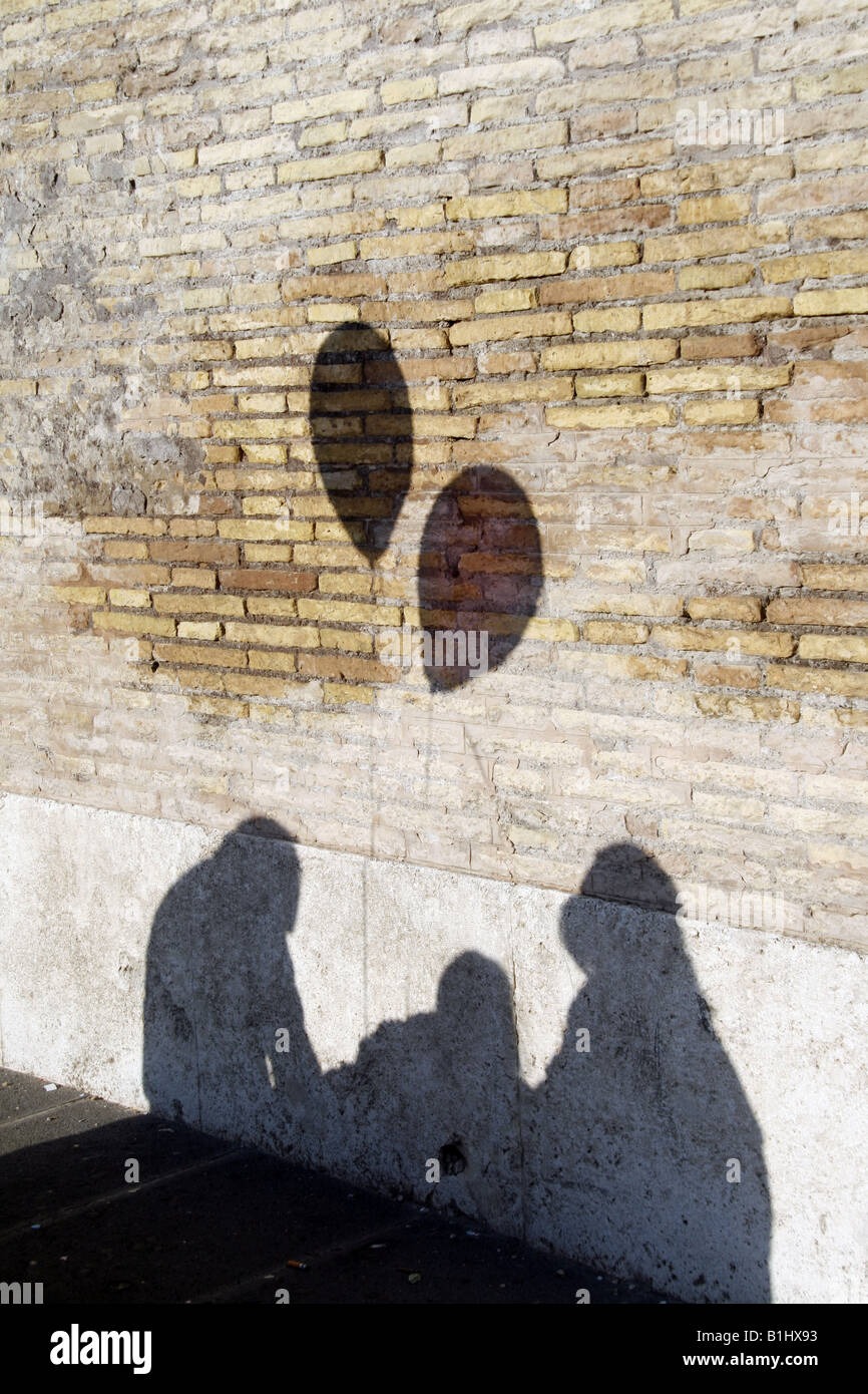 family with two balloons shadow against wall Stock Photo - Alamy