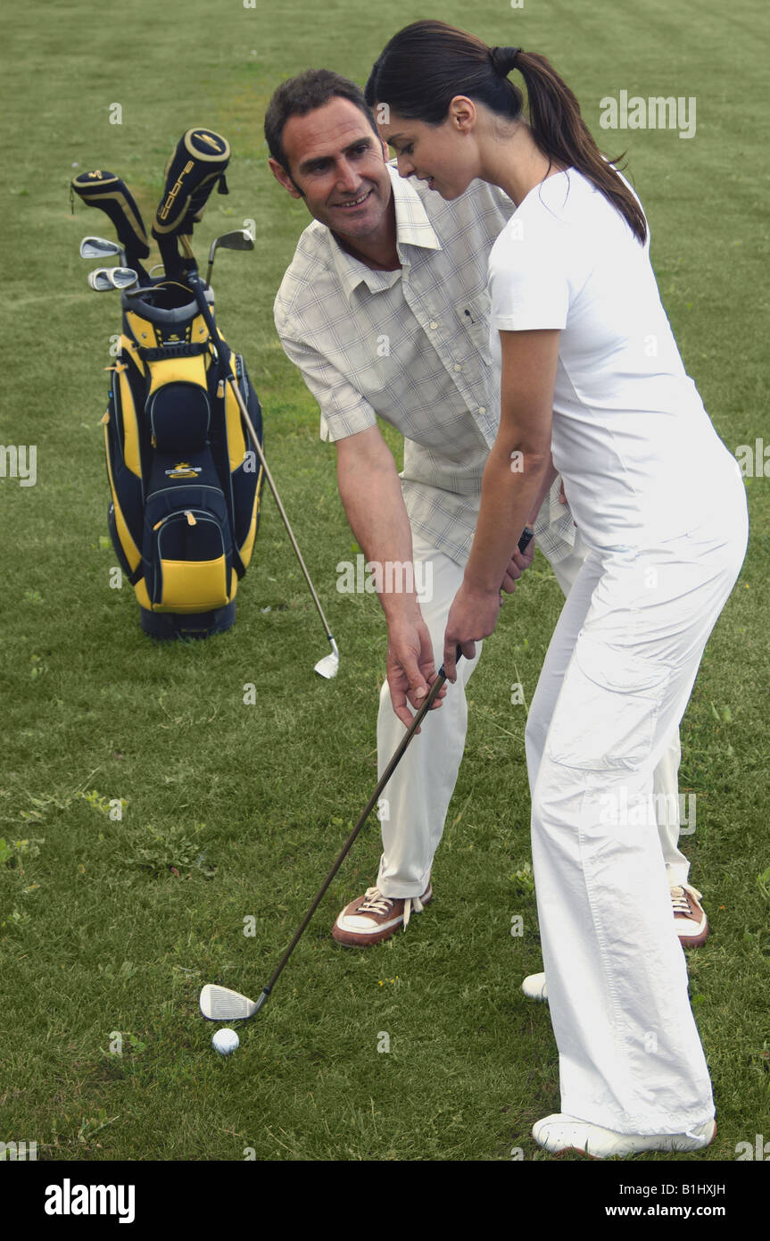 Caddy helping golfer hi-res stock photography and images - Alamy