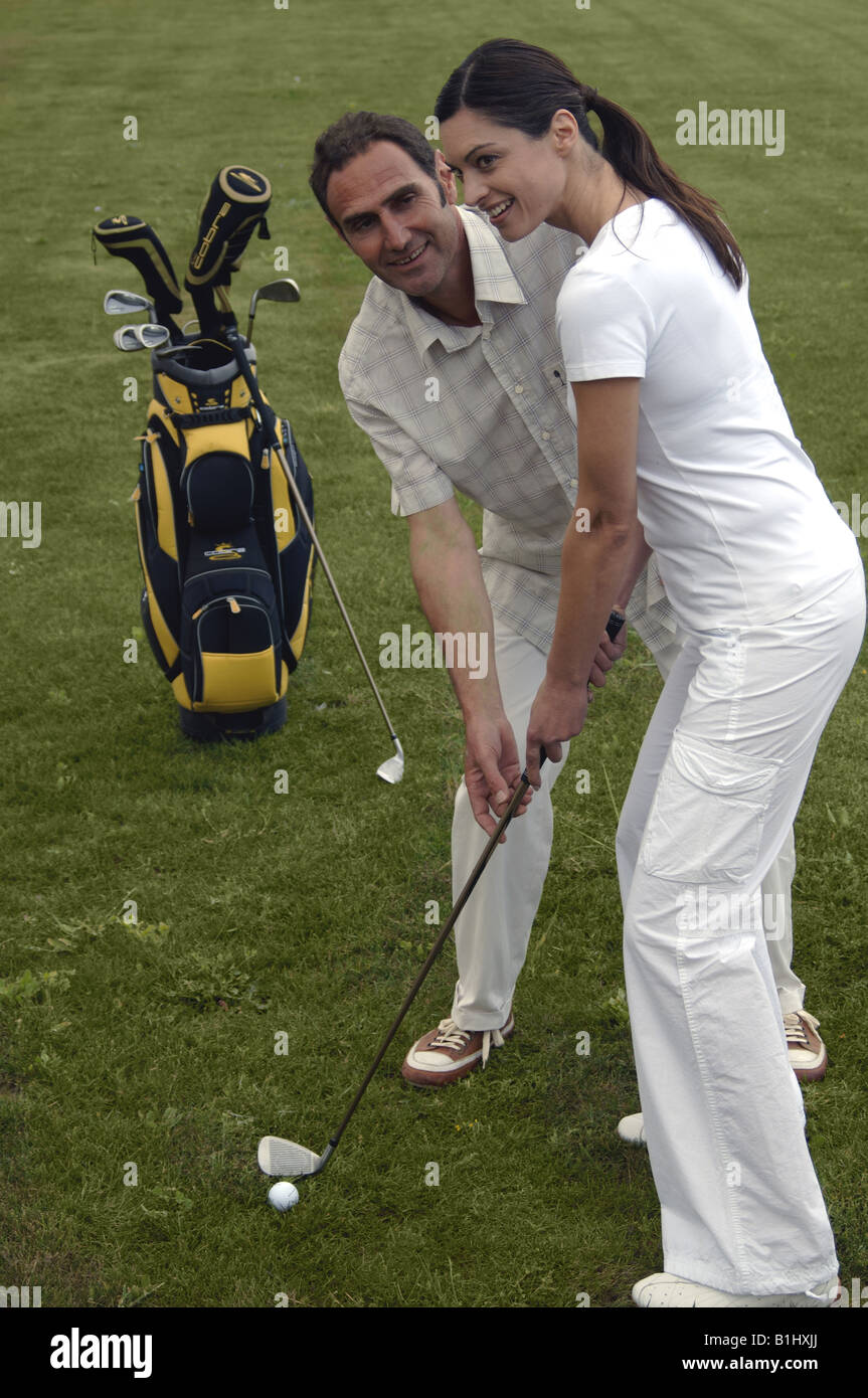Caddy helping golfer hi-res stock photography and images - Alamy