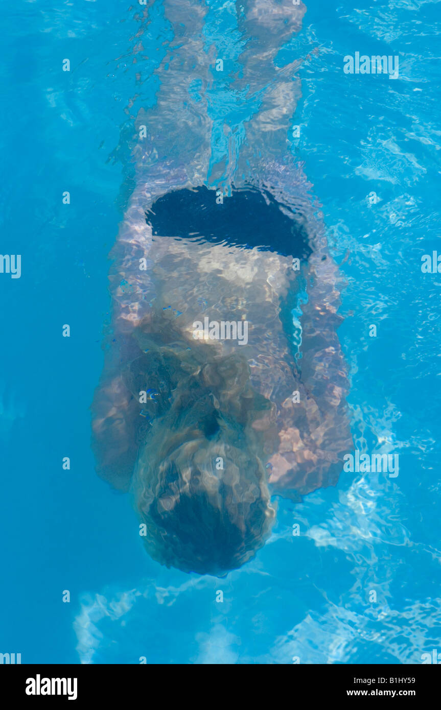 Woman diving in the water Stock Photo - Alamy