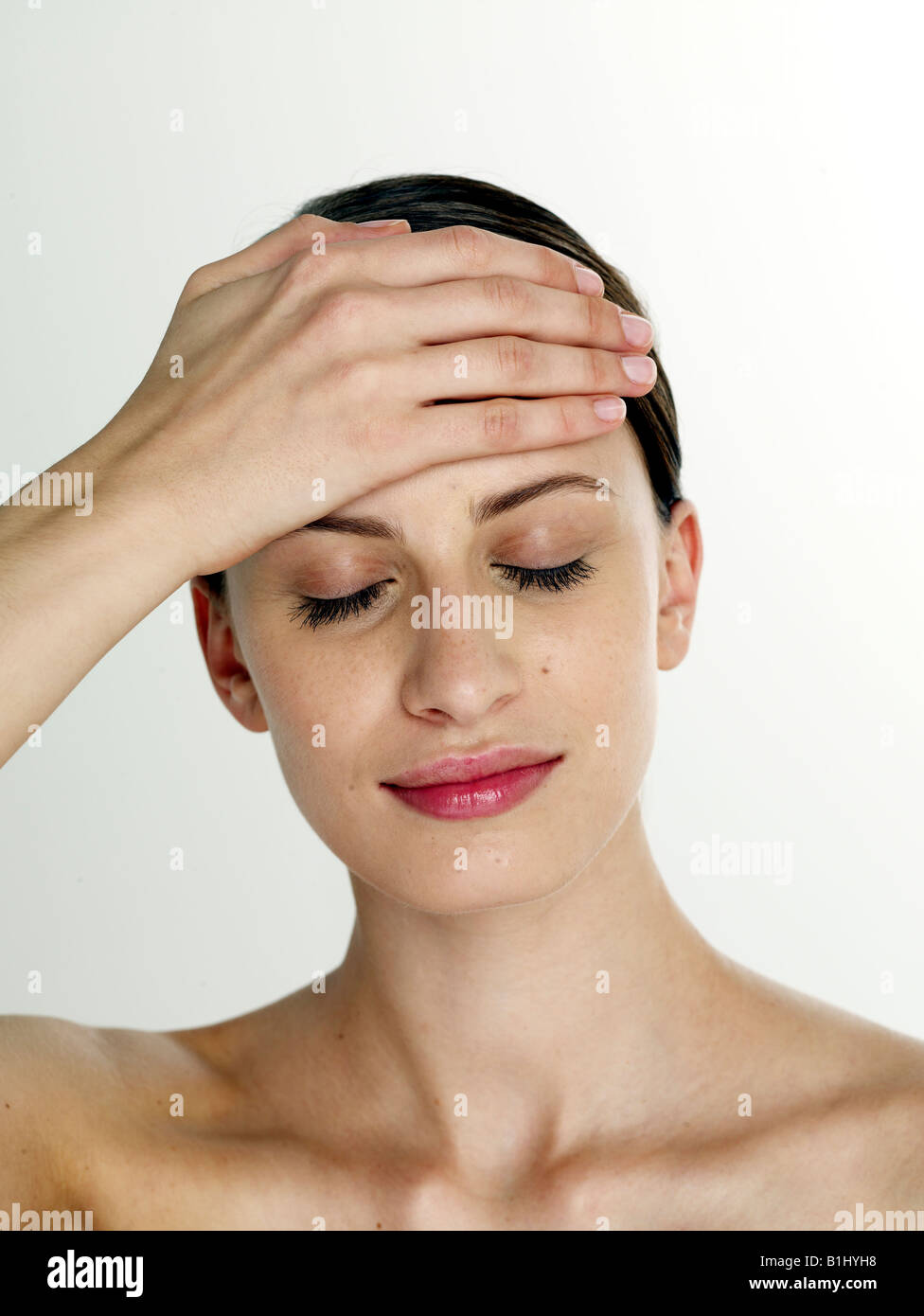 Woman is putting hands on her face Stock Photo - Alamy