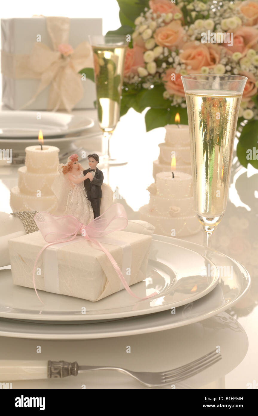 Wedding desk with bridal couple and a gift Stock Photo - Alamy