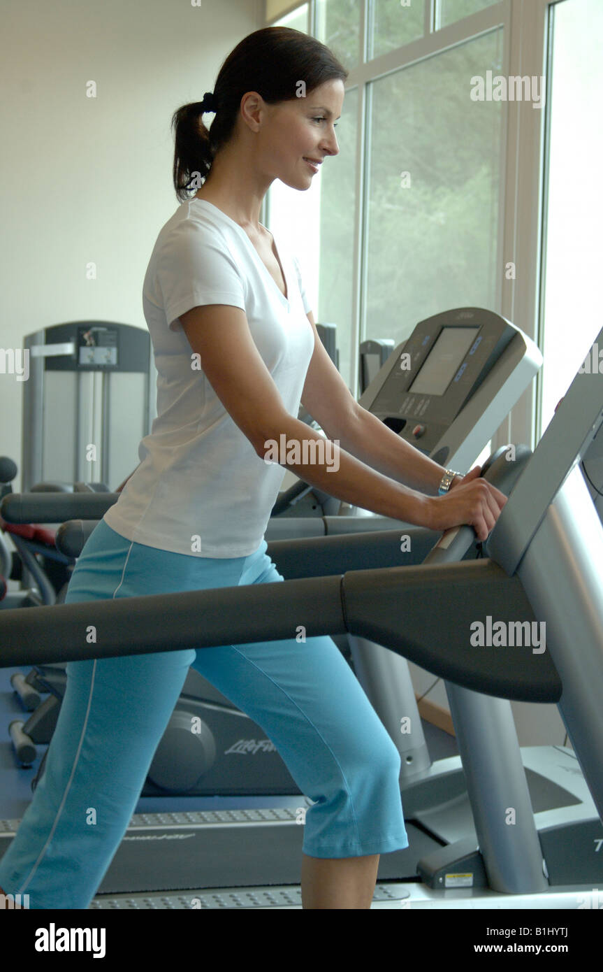 Woman working out on the treadmill Stock Photo - Alamy