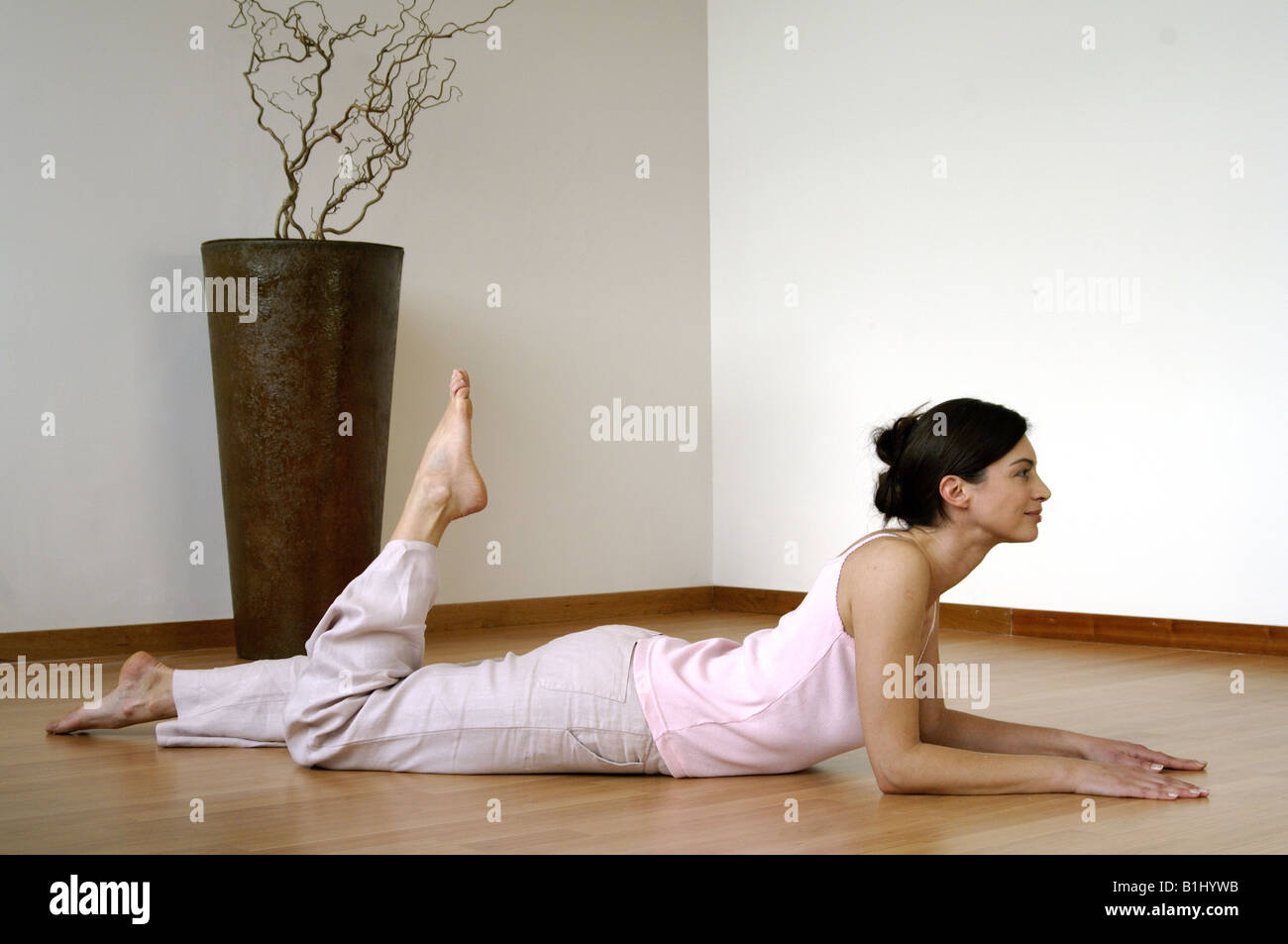 Woman doing yoga exercises Stock Photo - Alamy