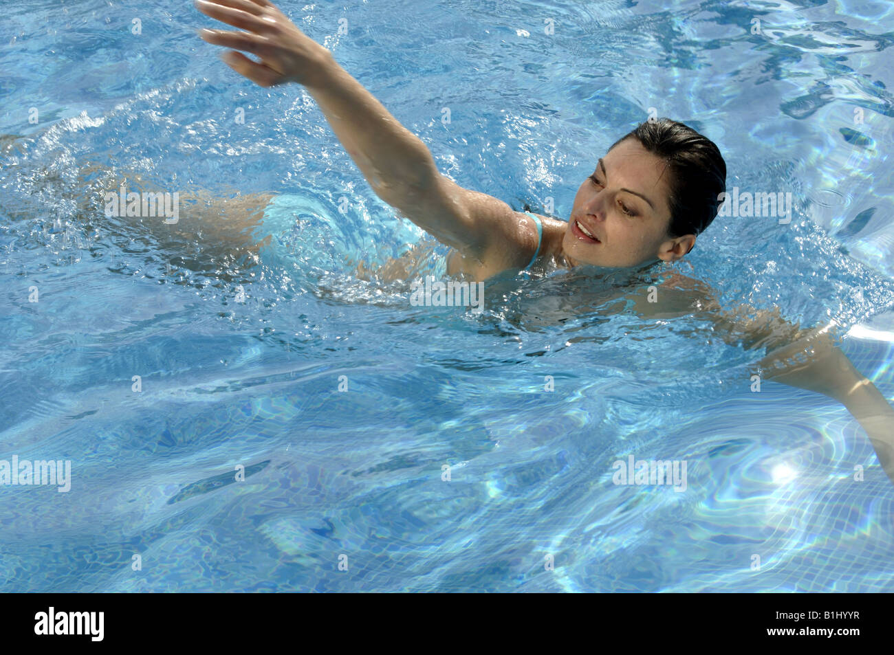 Woman doing front crawl Stock Photo - Alamy