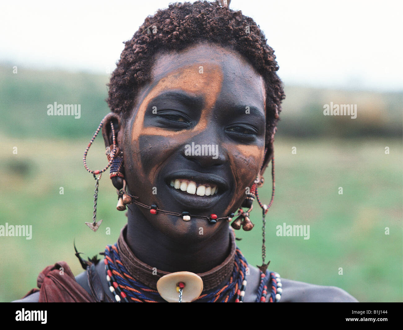 Portrait Of Maasai Moran Or Warrior Wearing Red Ochre Make Up And