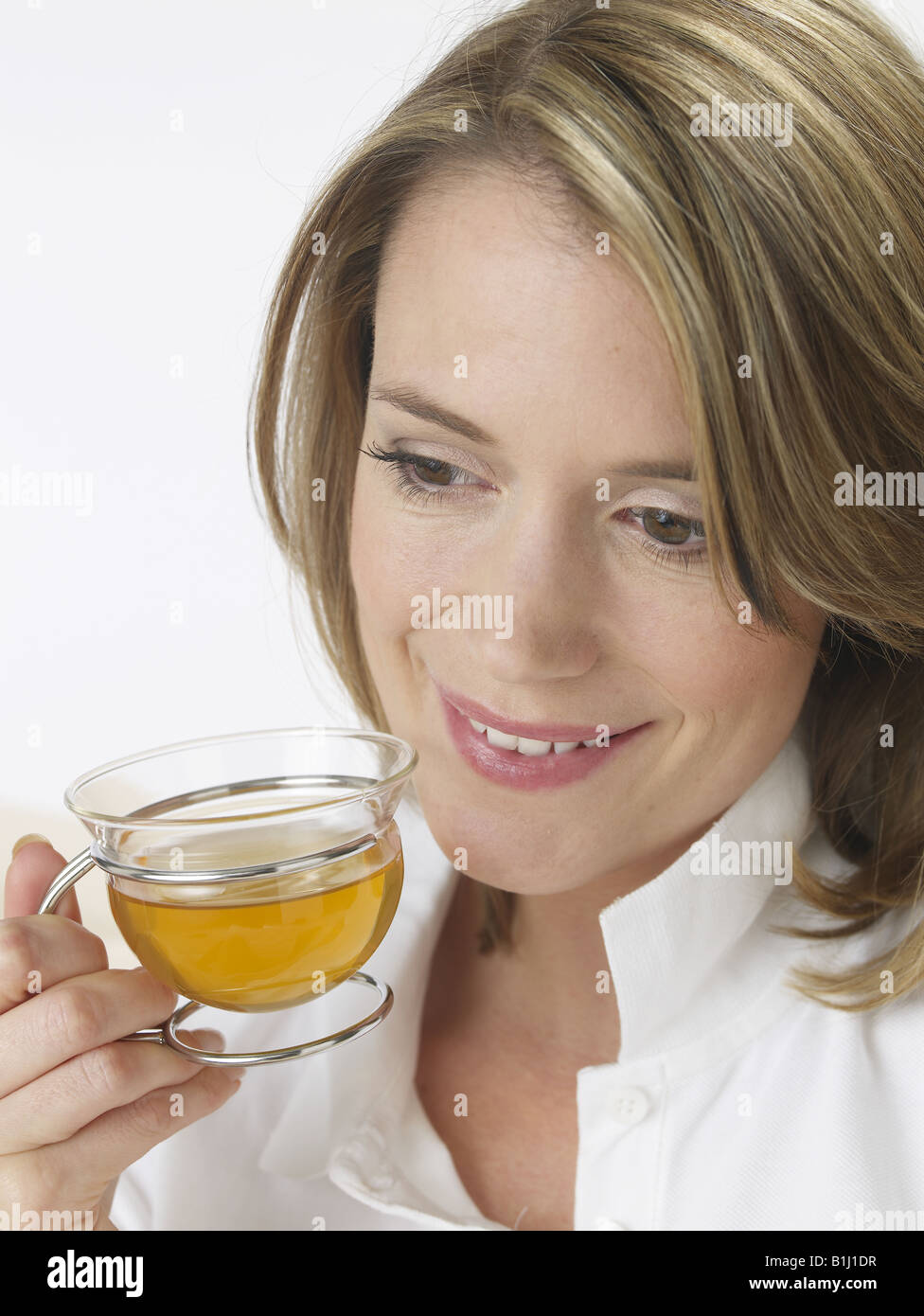 Woman with glass tea cup Stock Photo - Alamy