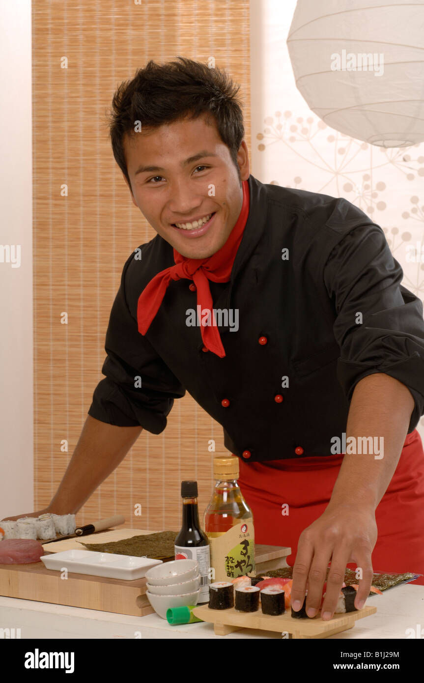 Asian chef preparing food Stock Photo - Alamy