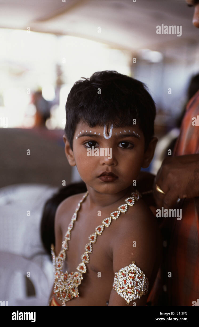 Close-up of a boy dressed as Lord Krishna in a religious festival of ...