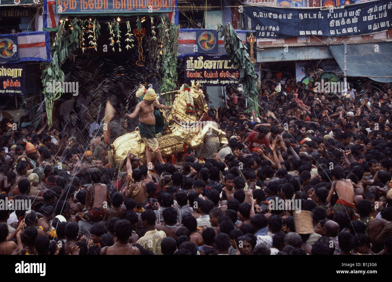 Ritual spraying of water on God Vishnu mounted on Golden horse during ...