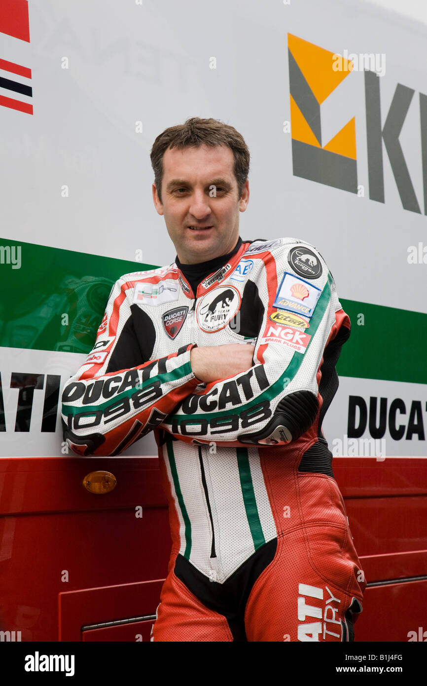 Michael Rutter rests against his Ducati team transporter in the Paddock ...