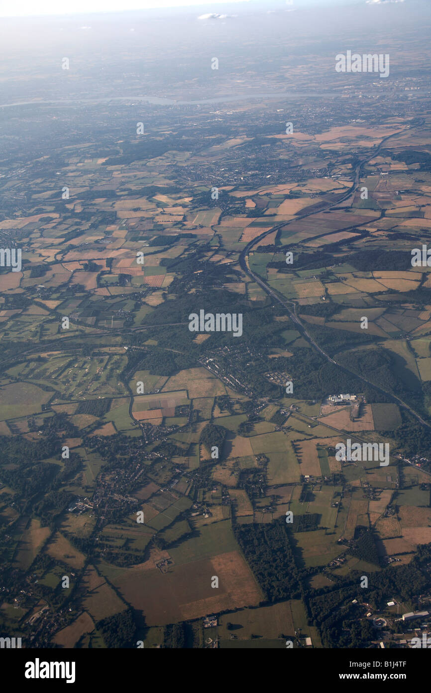 Aerial view north from commercial aircraft of M25 Jn 4 Halstead and ...