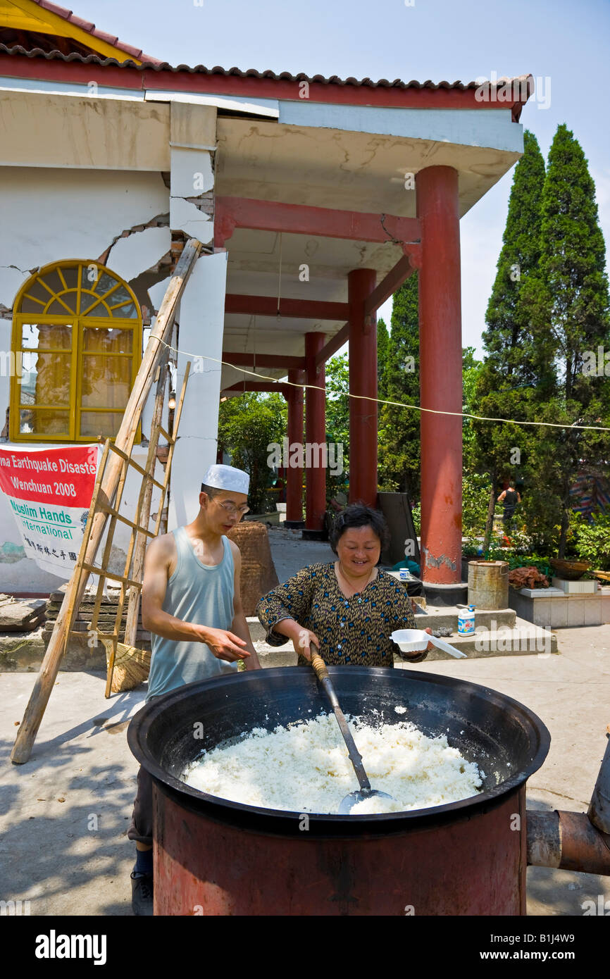 Food cooking outside earthquake severely damaged mosque in Luoshui ...