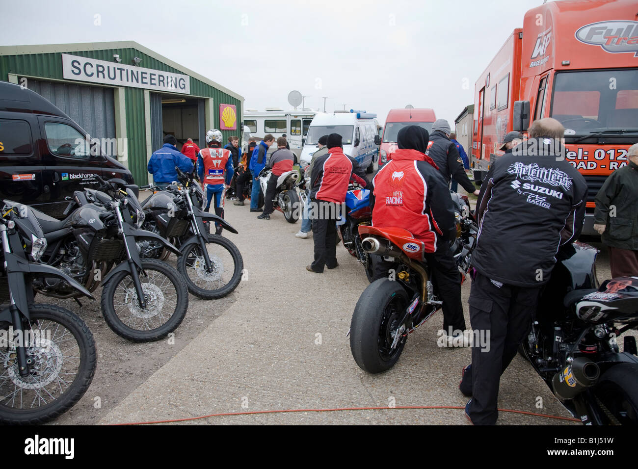Racing motorcycles queue to pass through scrutineering during practice ...