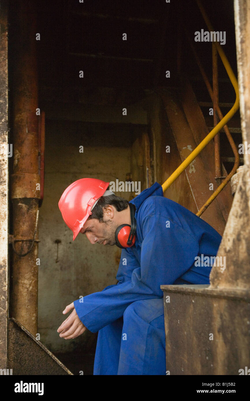 A worker thinking Stock Photo - Alamy