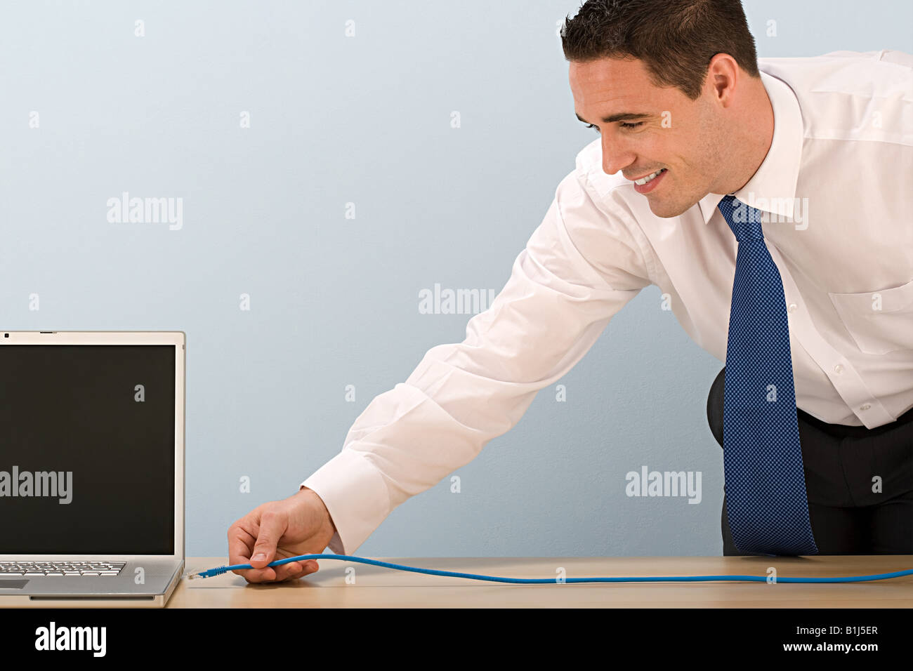 Man with network cable Stock Photo - Alamy