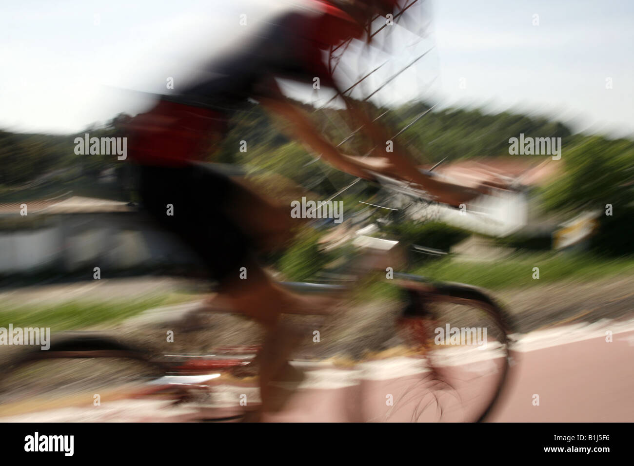 one fast bike rider in countryside Stock Photo - Alamy