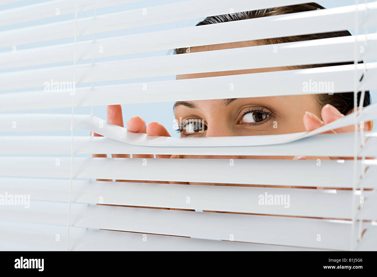 Peeking Through Blinds High Resolution Stock Photography and Images - Alamy