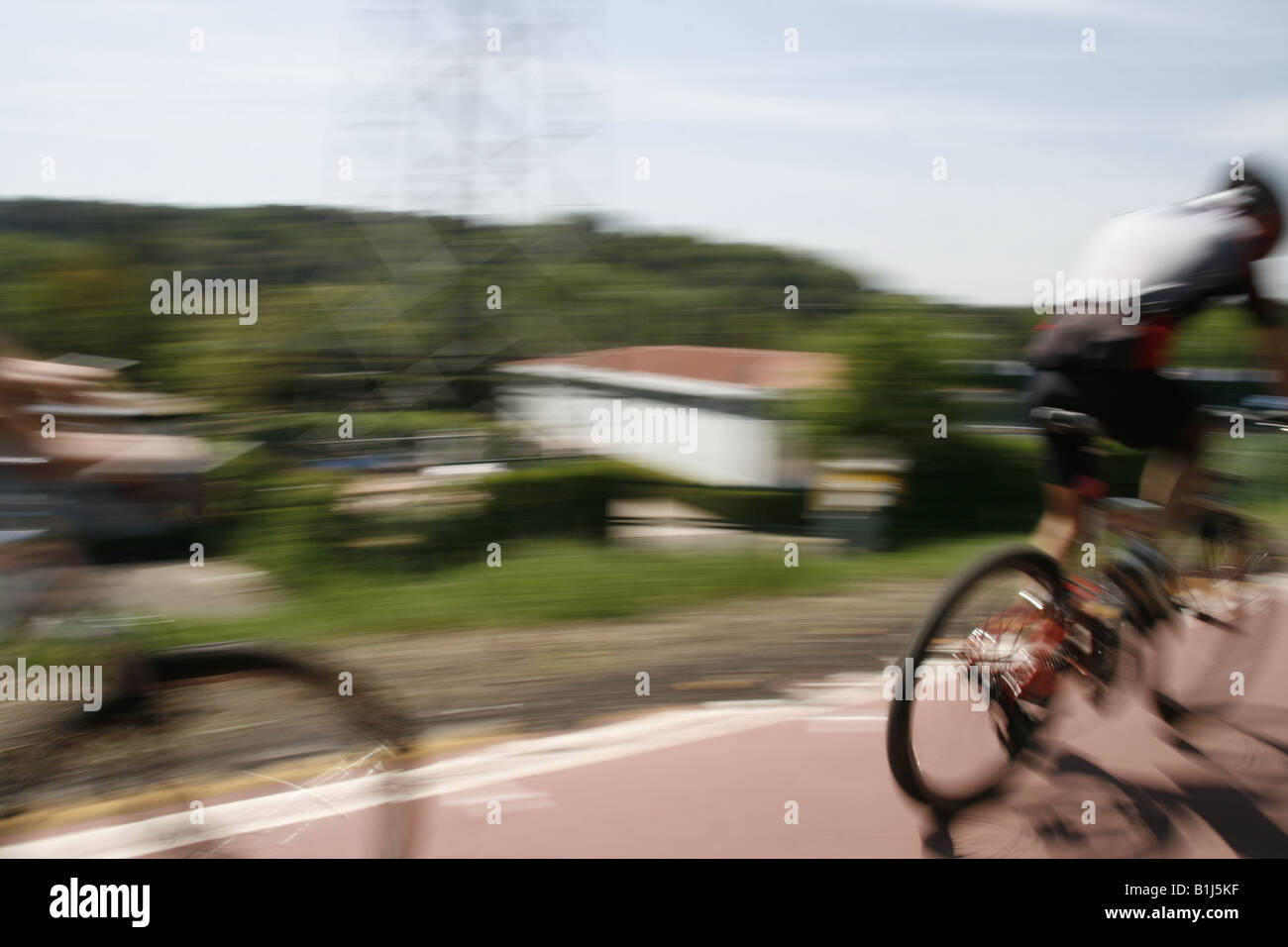 two fast bike riders in countryside Stock Photo - Alamy