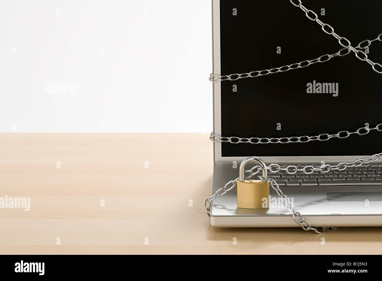 Chain and lock on laptop Stock Photo - Alamy