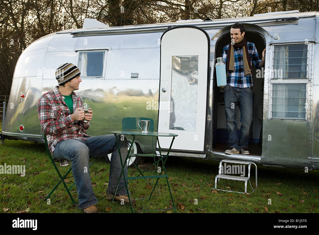 Two teenage boys and a caravan Stock Photo - Alamy