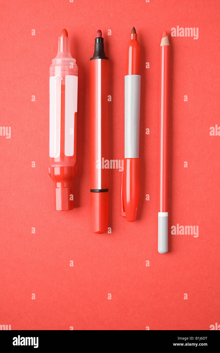 Red pens and pencil Stock Photo - Alamy