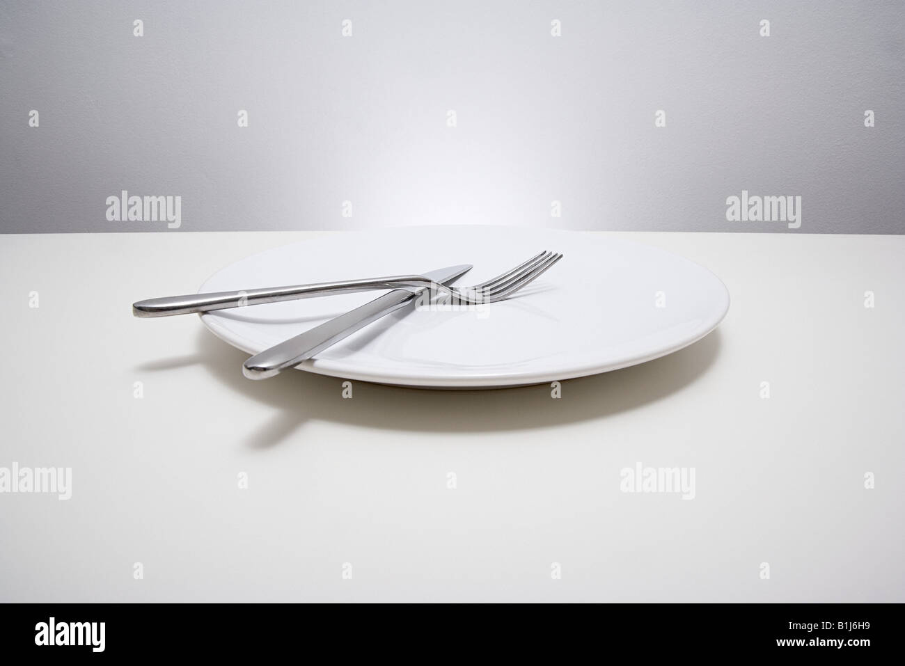 Knife fork and plate Stock Photo - Alamy