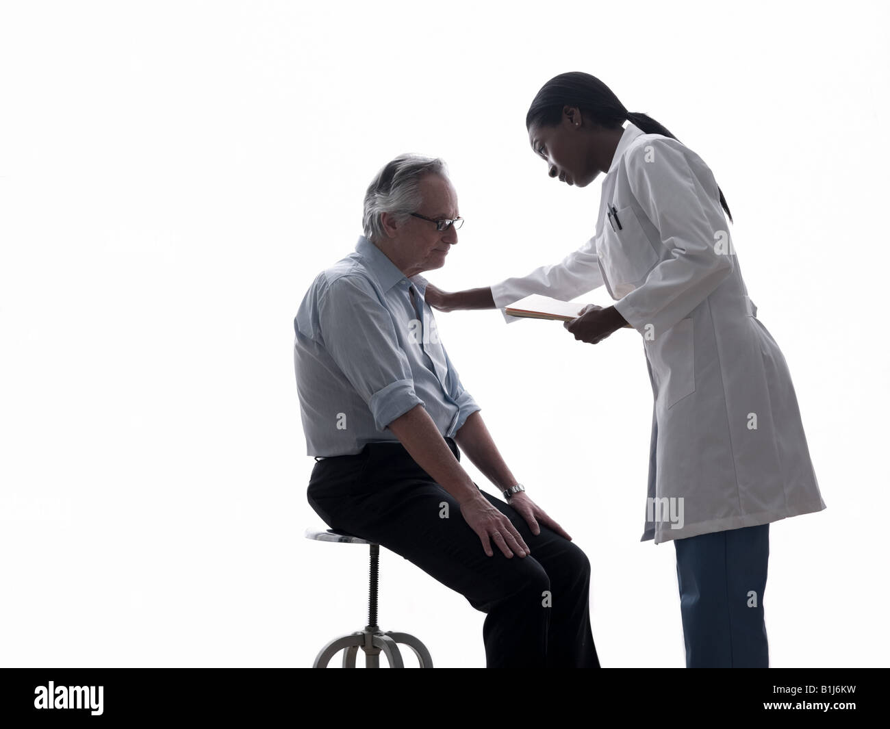 Male doctor talking to woman patient Cut Out Stock Images & Pictures ...