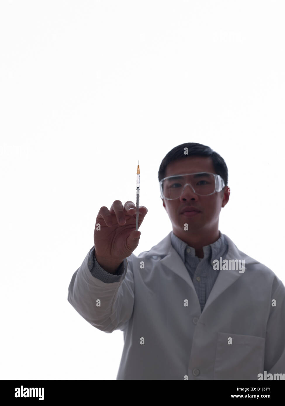 Doctor with syringe Stock Photo - Alamy