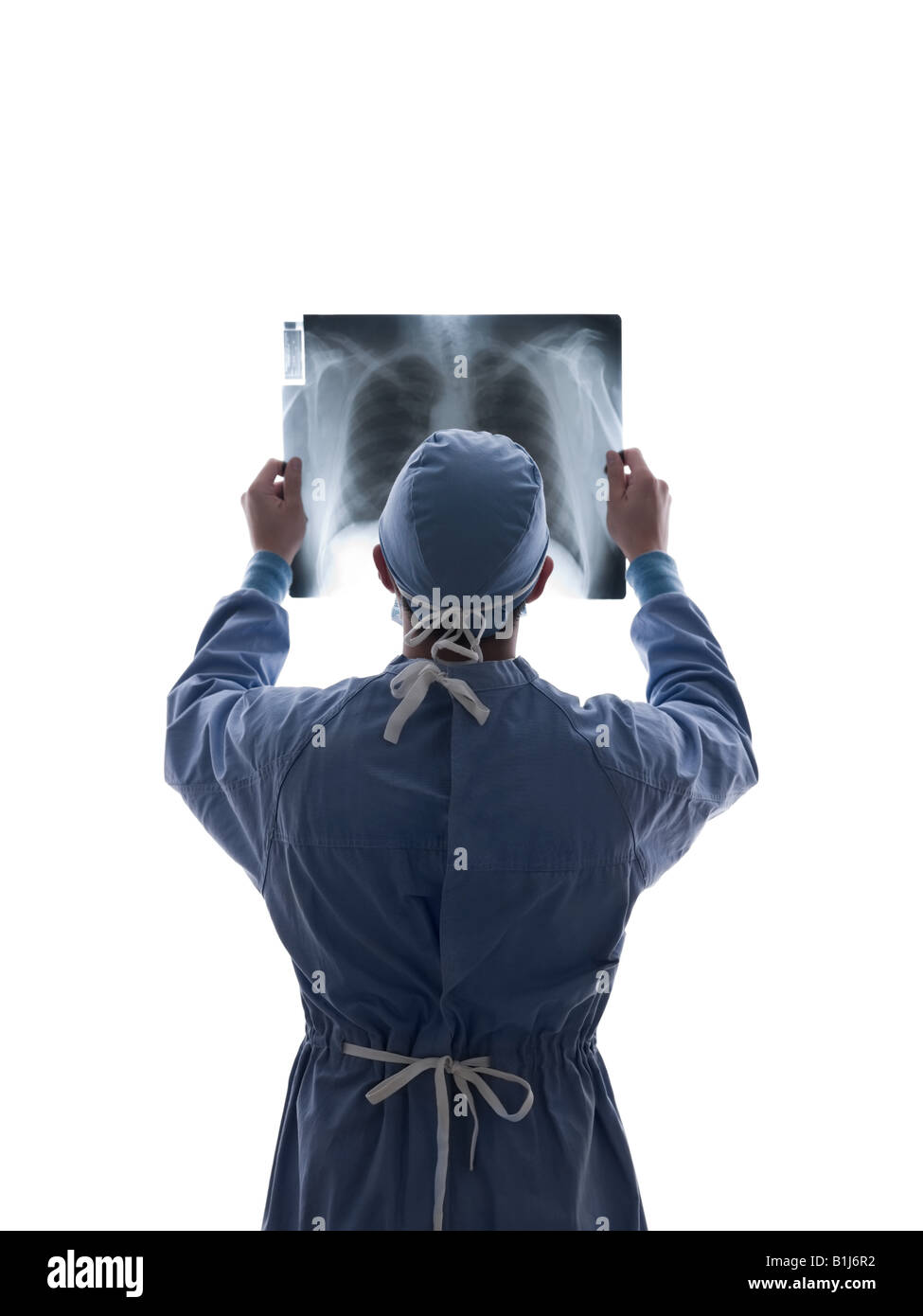 Surgeon looking at x-ray Stock Photo - Alamy