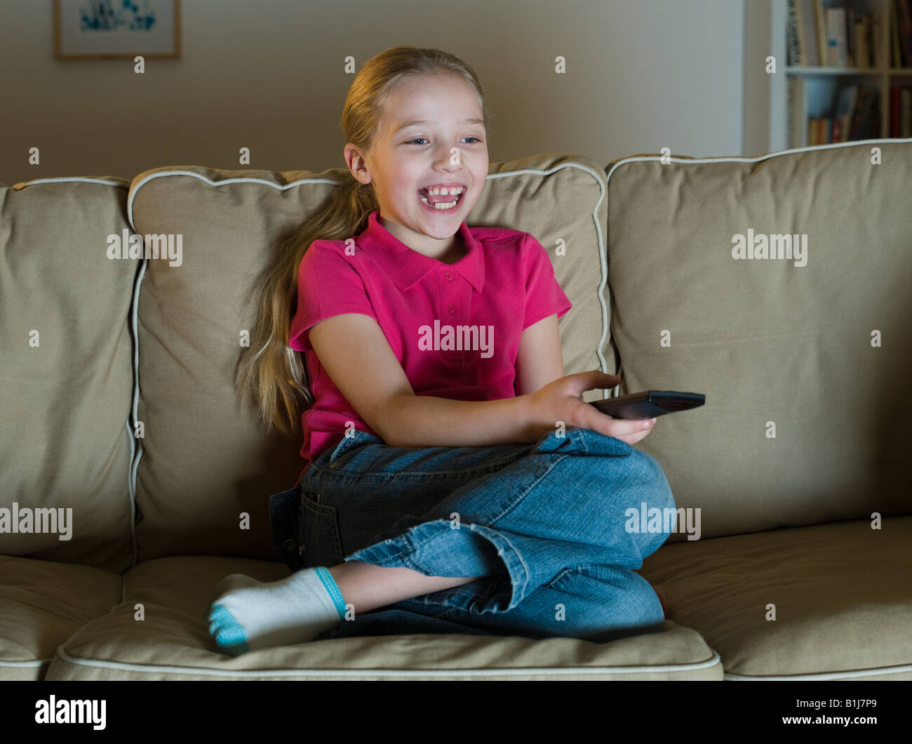 A girl watching tv Stock Photo - Alamy